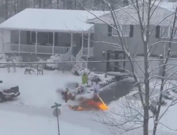 Man clears snowy driveway with flamethrower in US; video goes viral ...