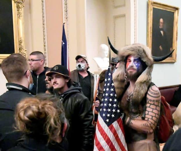 Man who wore bearskin headdress and horns charged in US Capitol riots ...