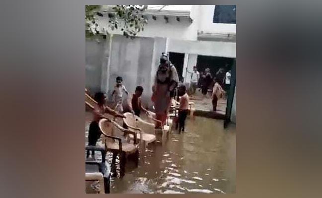 Students hold chairs in flood waters for teacher in UP; video surfaces