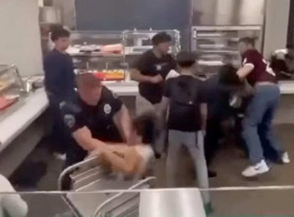 Video shows police officer slamming student into lunch cart during ...