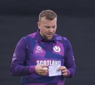 Pic of Scotland bowler looking at a note while bowling in T20 World Cup ...
