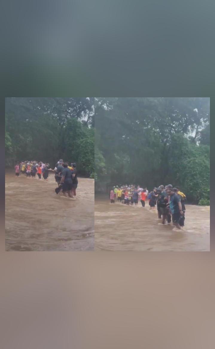 Human chain formed to rescue 20 people trapped in floodwaters in Mumbai ...